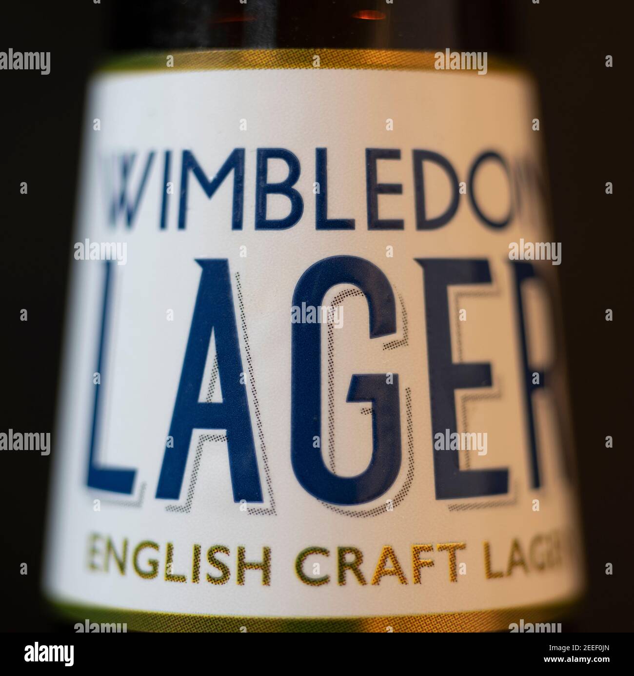 Wimbledon English Craft Lager beer bottle neck label closeup Stock ...