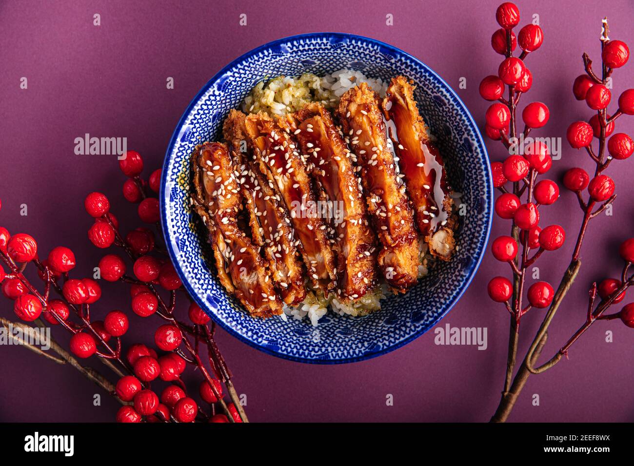 Katsudon fried chicken with rice in a bowl Stock Photo - Alamy