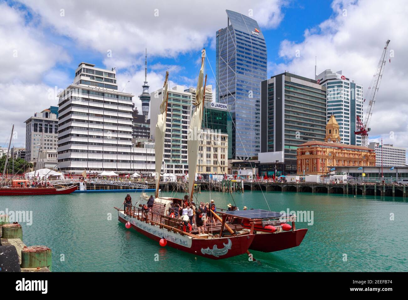 A twin-hulled, ocean-going Maori waka (canoe) sails into Auckland, New ...