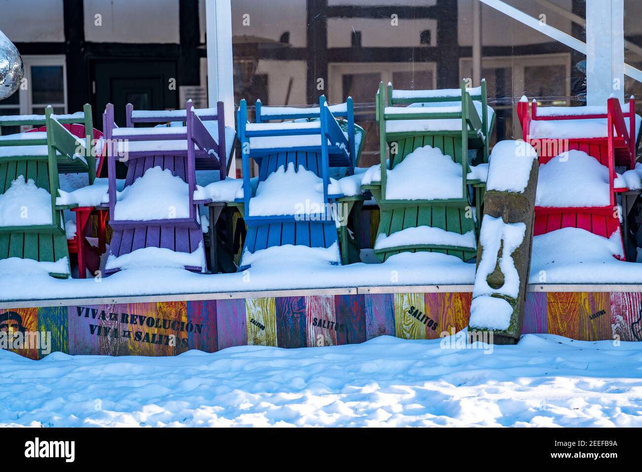 Winter in the Ruhr area, Baldeneysee, snowy beer garden furniture of a ...