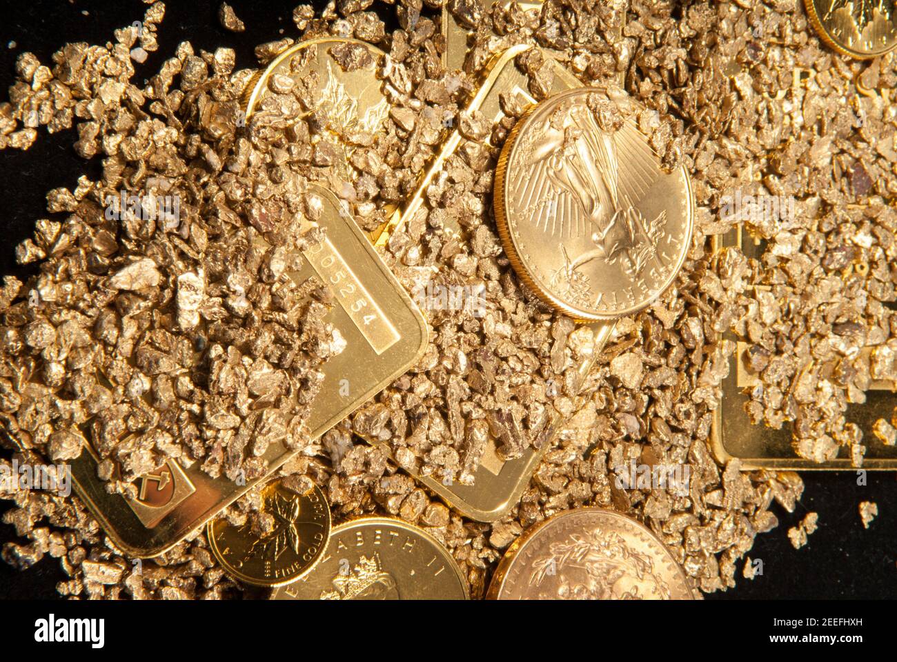 gold in coins, nuggets and ingots Stock Photo - Alamy
