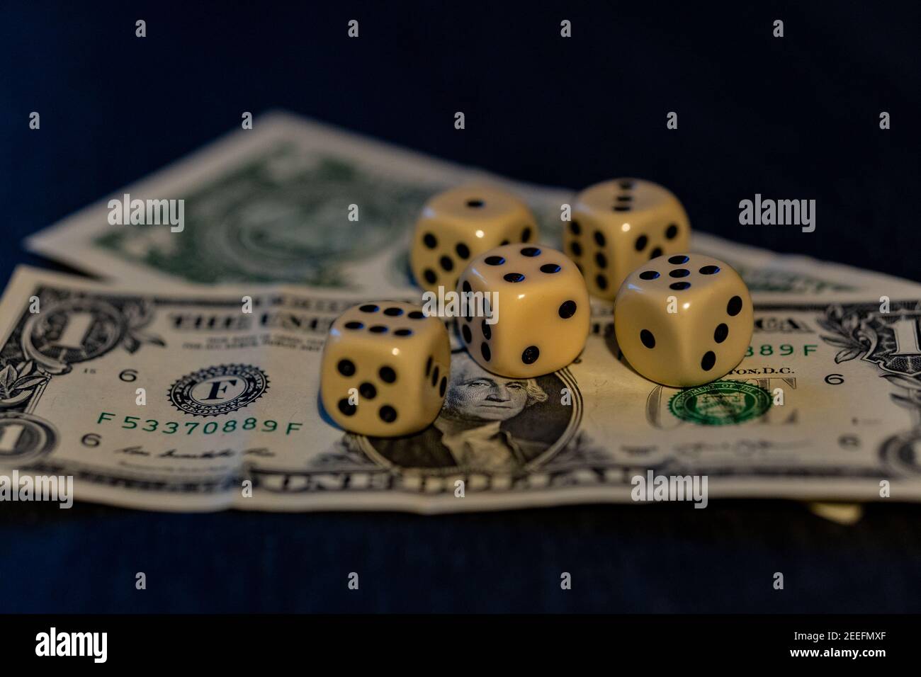Dice lie on dollar banknotes. Symbol for gambling debts and gambling ...