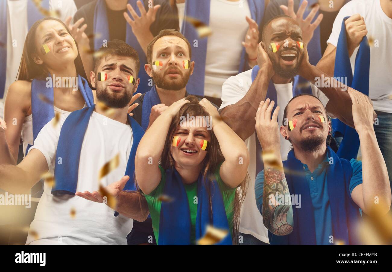 Belgian football, soccer fans cheering their team with a blue scarfs at ...