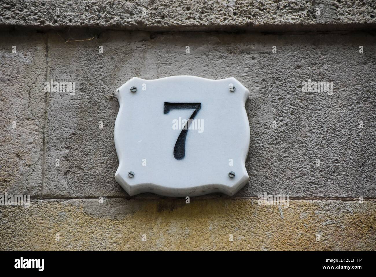 Old number seven in a wall Stock Photo - Alamy