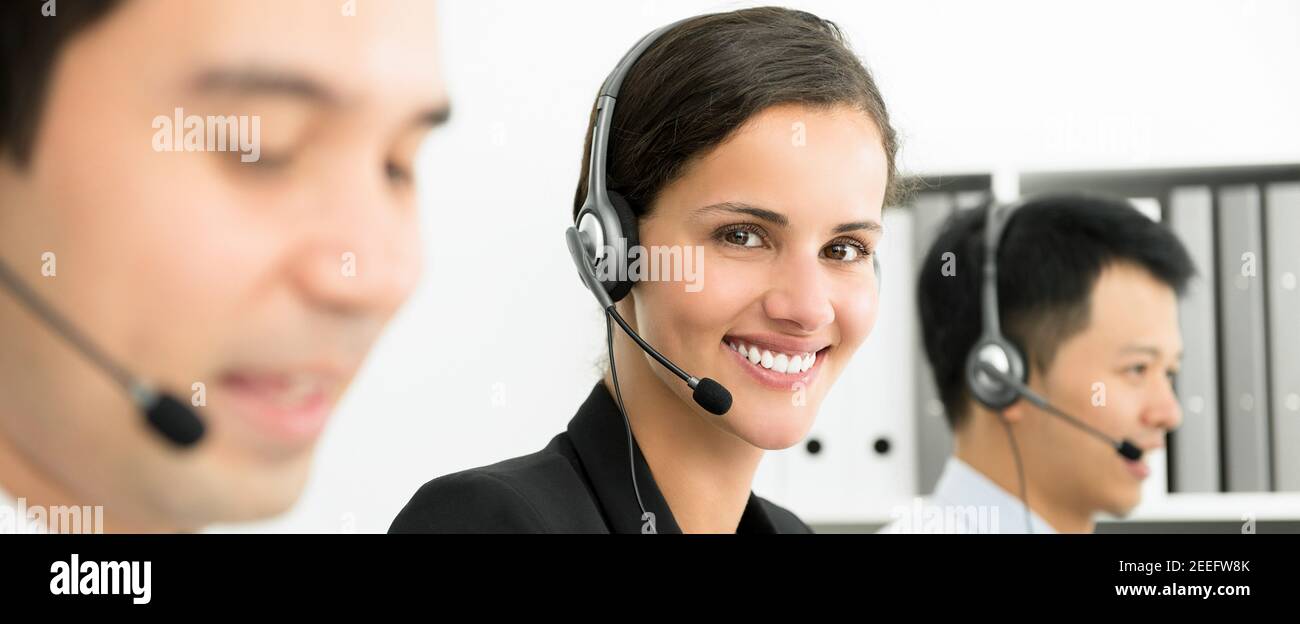 Smiling attractive business woman working in call center - web banner ...