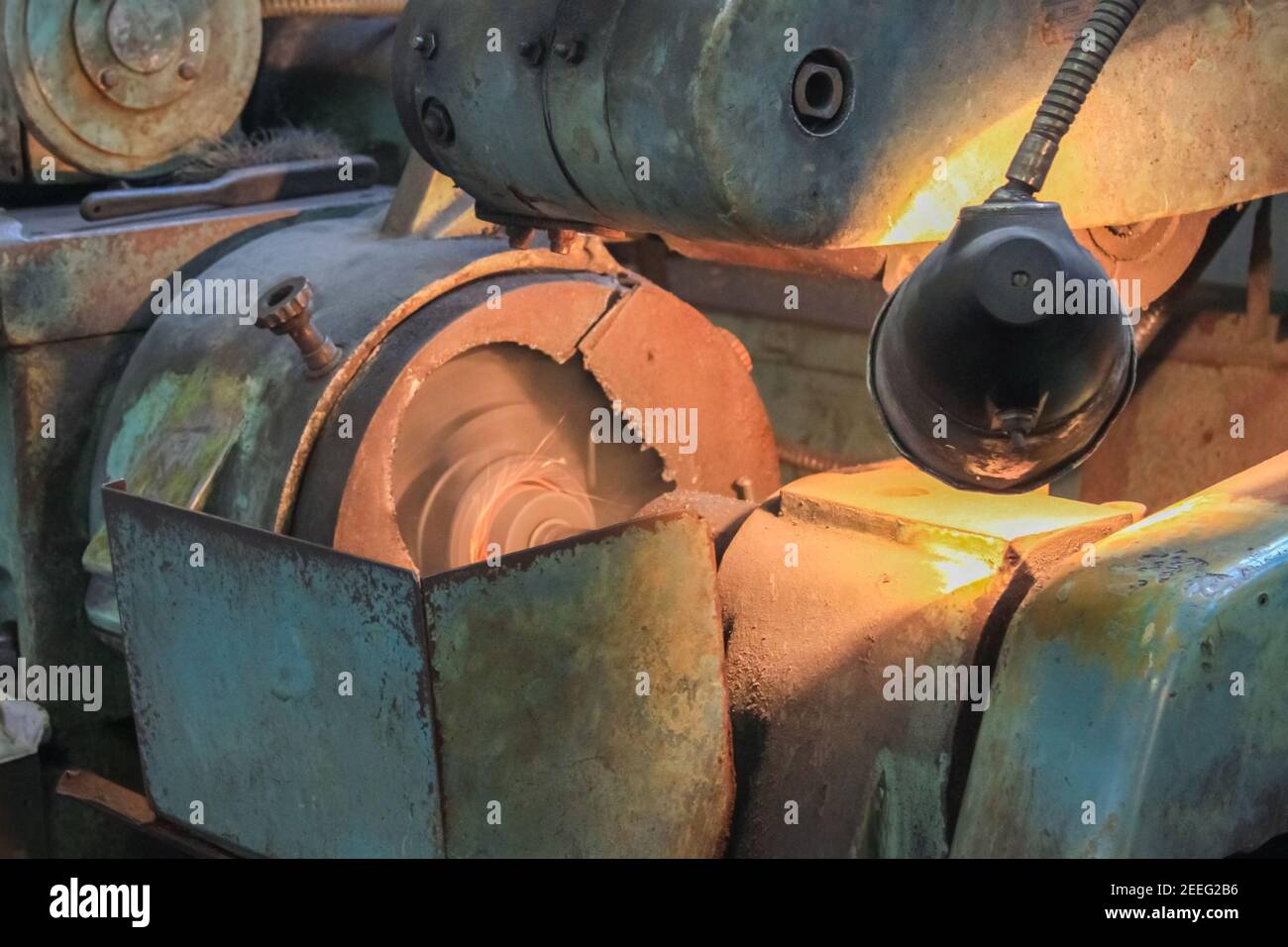 Old grinding machine in the production shop Stock Photo - Alamy