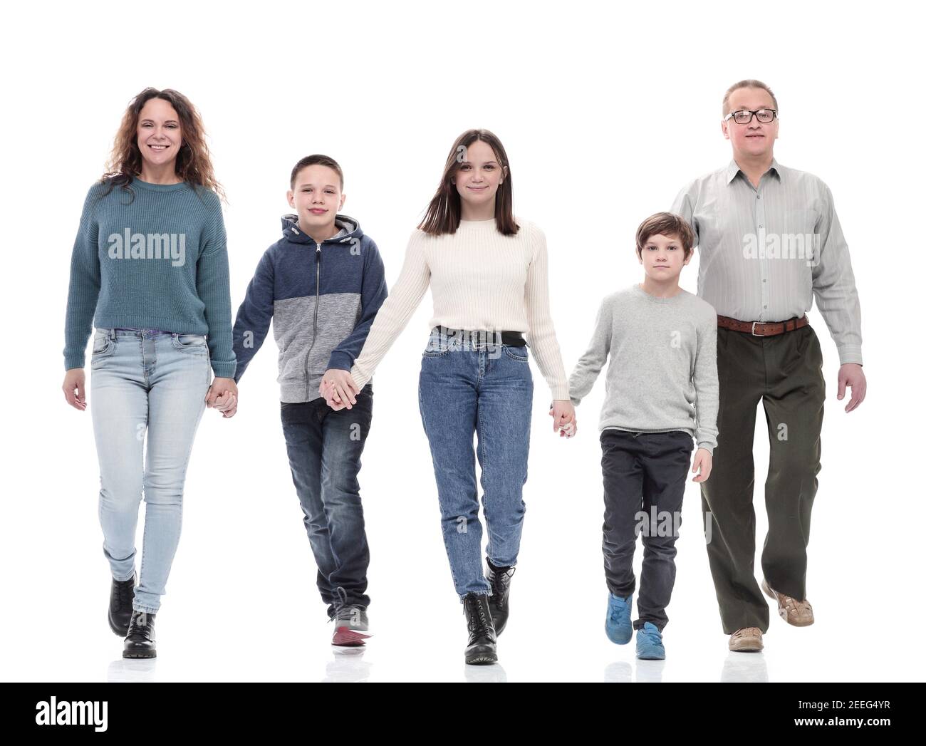 happy family in casual clothes walking forward Stock Photo - Alamy