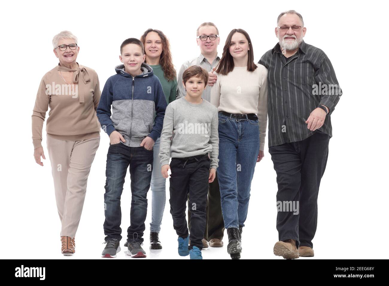 happy family in casual clothes walking forward Stock Photo - Alamy
