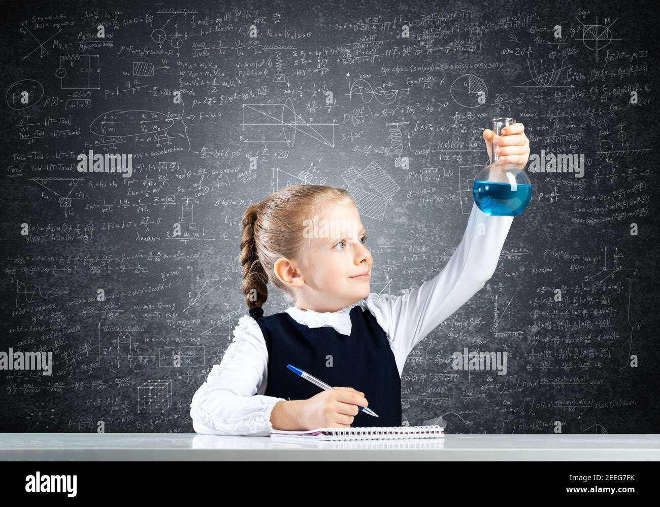 Little girl scientist examining test tube Stock Photo - Alamy
