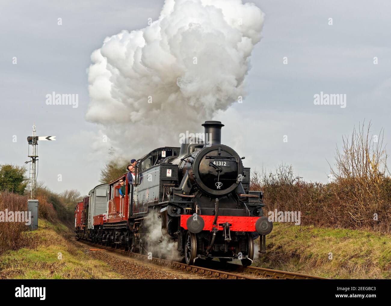 Steam goods train hauled by an Ivatt Class 2 tank engine near Ropley on ...