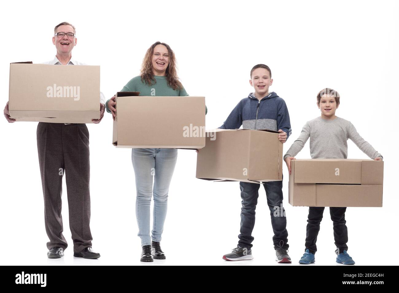 in full growth. happy family with cardboard boxes Stock Photo - Alamy
