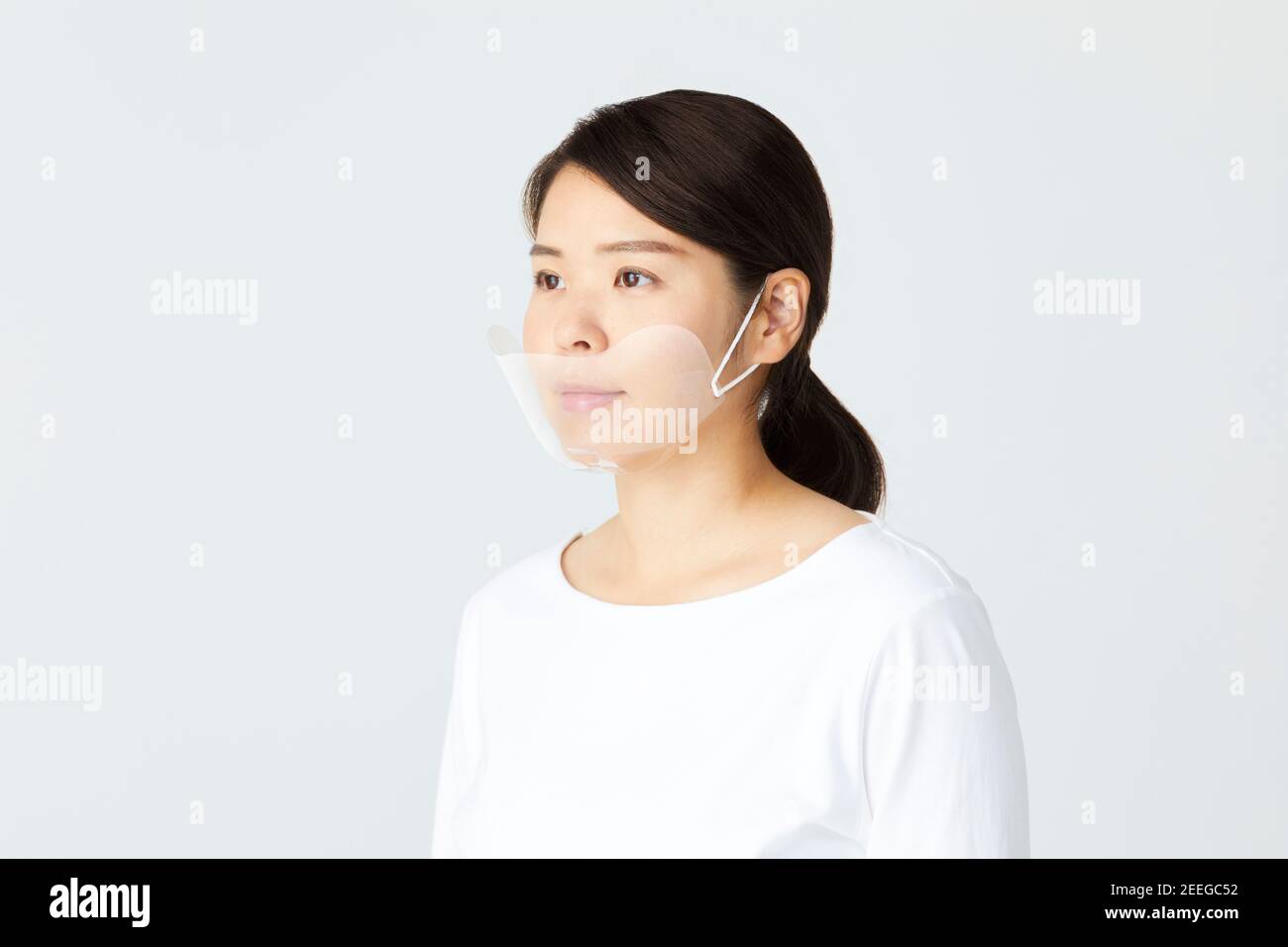 Japanese woman wearing face shield Stock Photo - Alamy