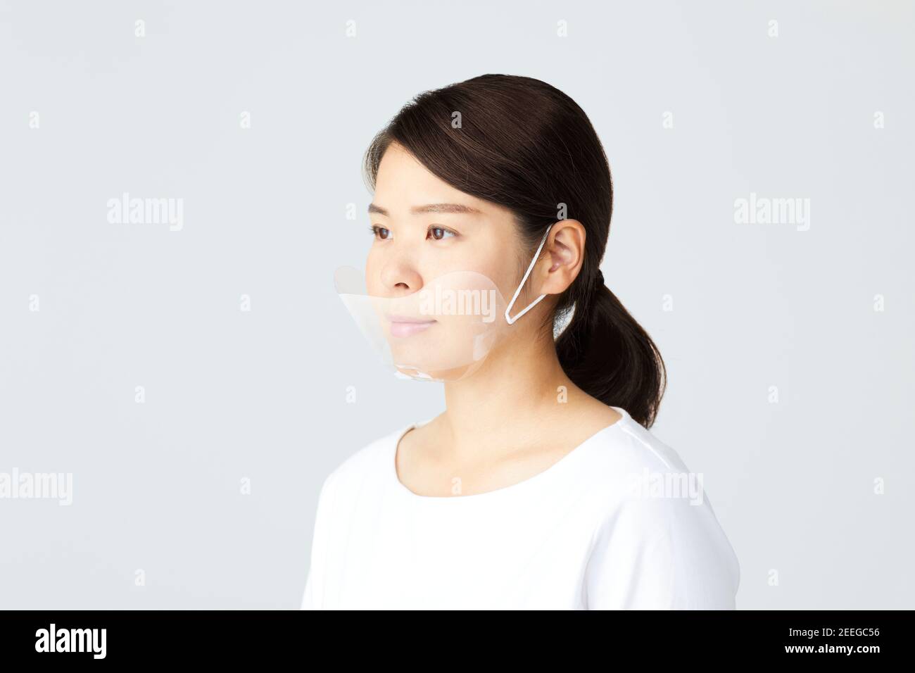 Japanese woman wearing face shield Stock Photo - Alamy