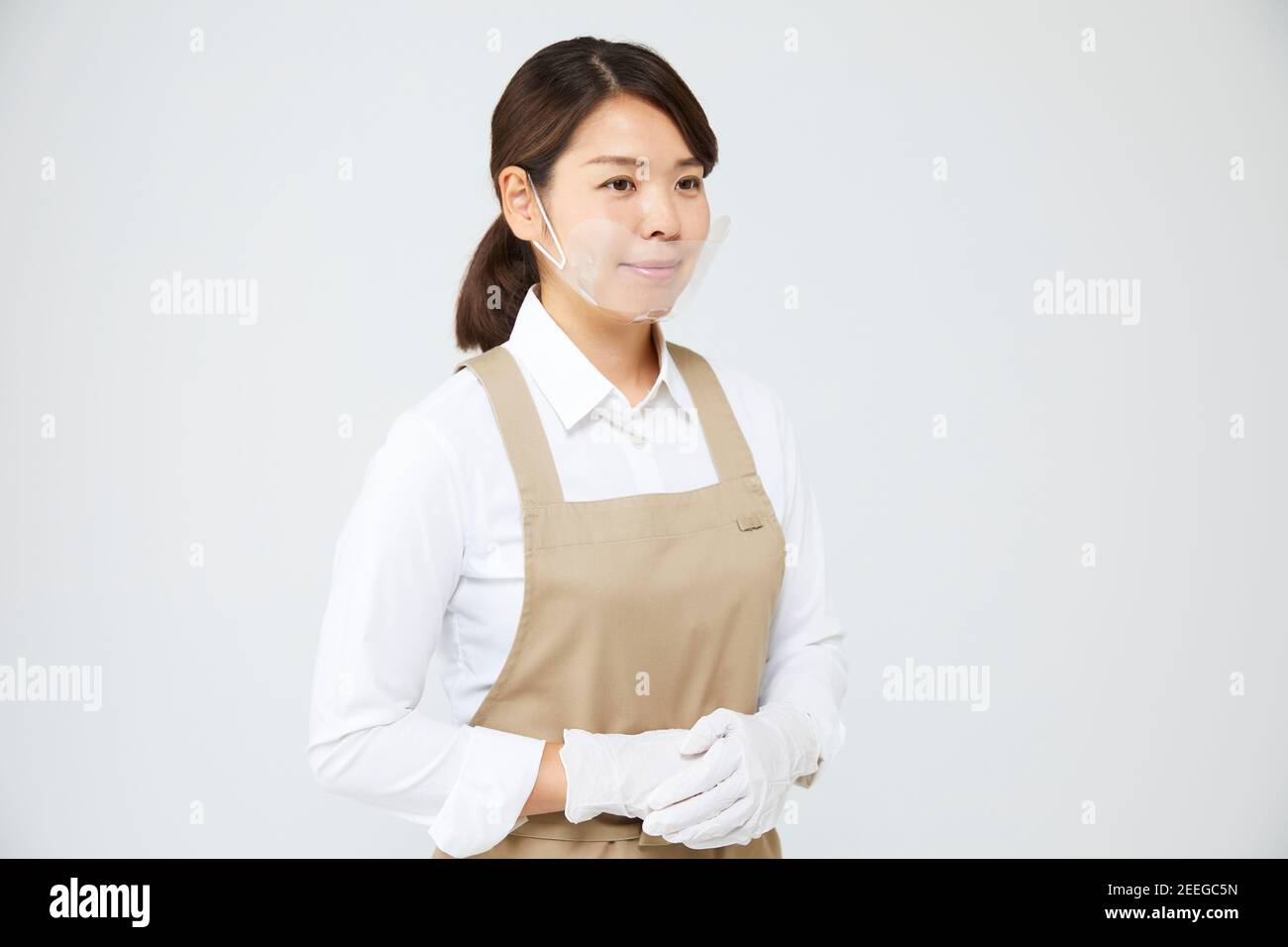 Japanese woman wearing face shield Stock Photo - Alamy