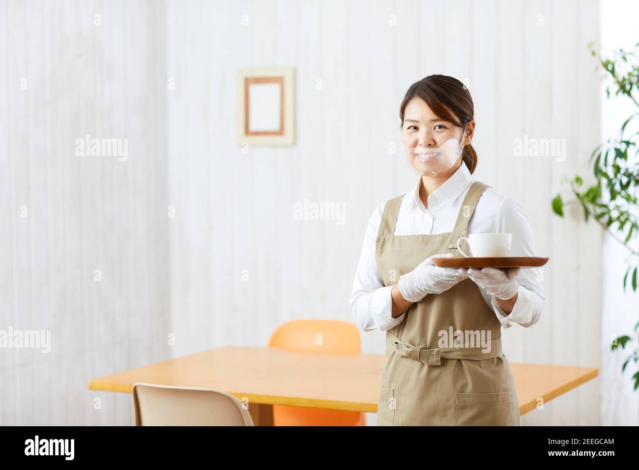 Japanese woman wearing face shield Stock Photo - Alamy