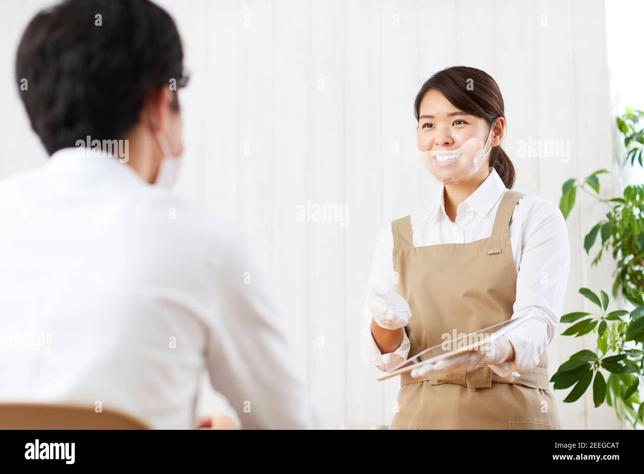 Japanese woman wearing face shield Stock Photo - Alamy