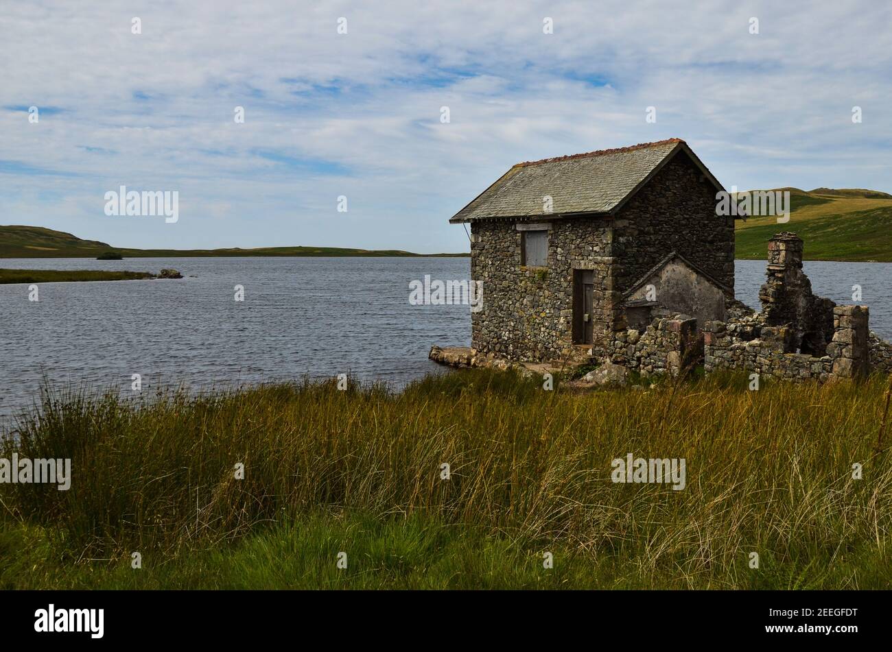 Small stone shelter by the lake in Lake district, UK Stock Photo - Alamy