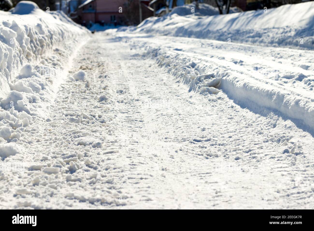 Winter snow covered road. Fresh snowdrift way. Snowy covered street ...
