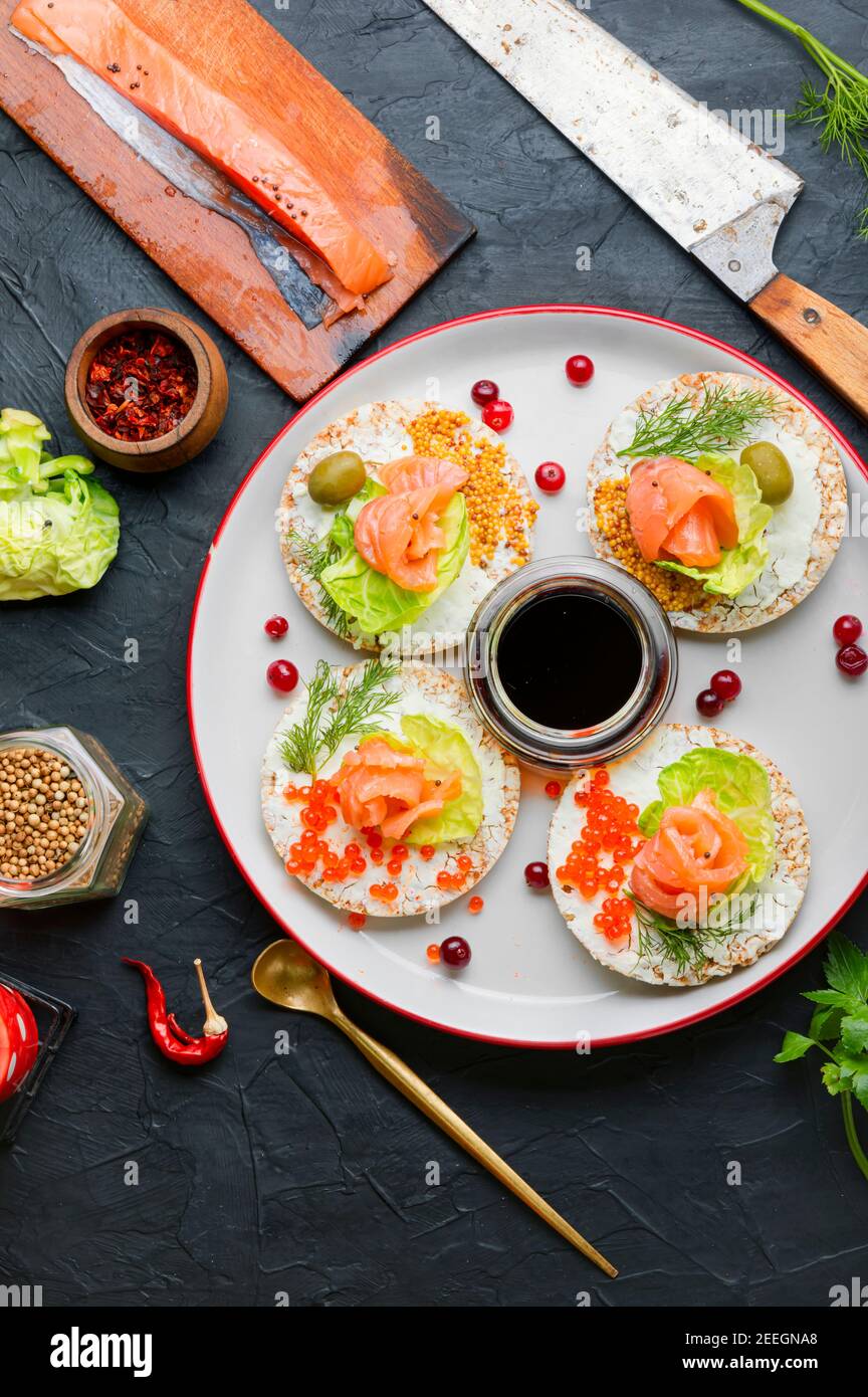 Tasty bruschetta or canapes with salmon and cheese.Bread with salmon ...