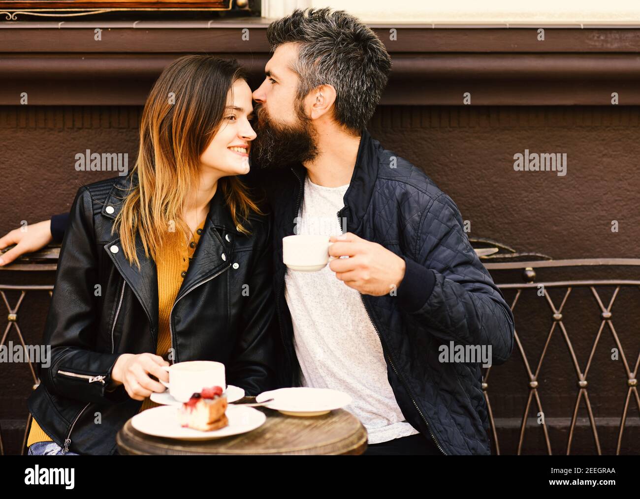 Couple in love drinks espresso during coffee break. Love at urban ...