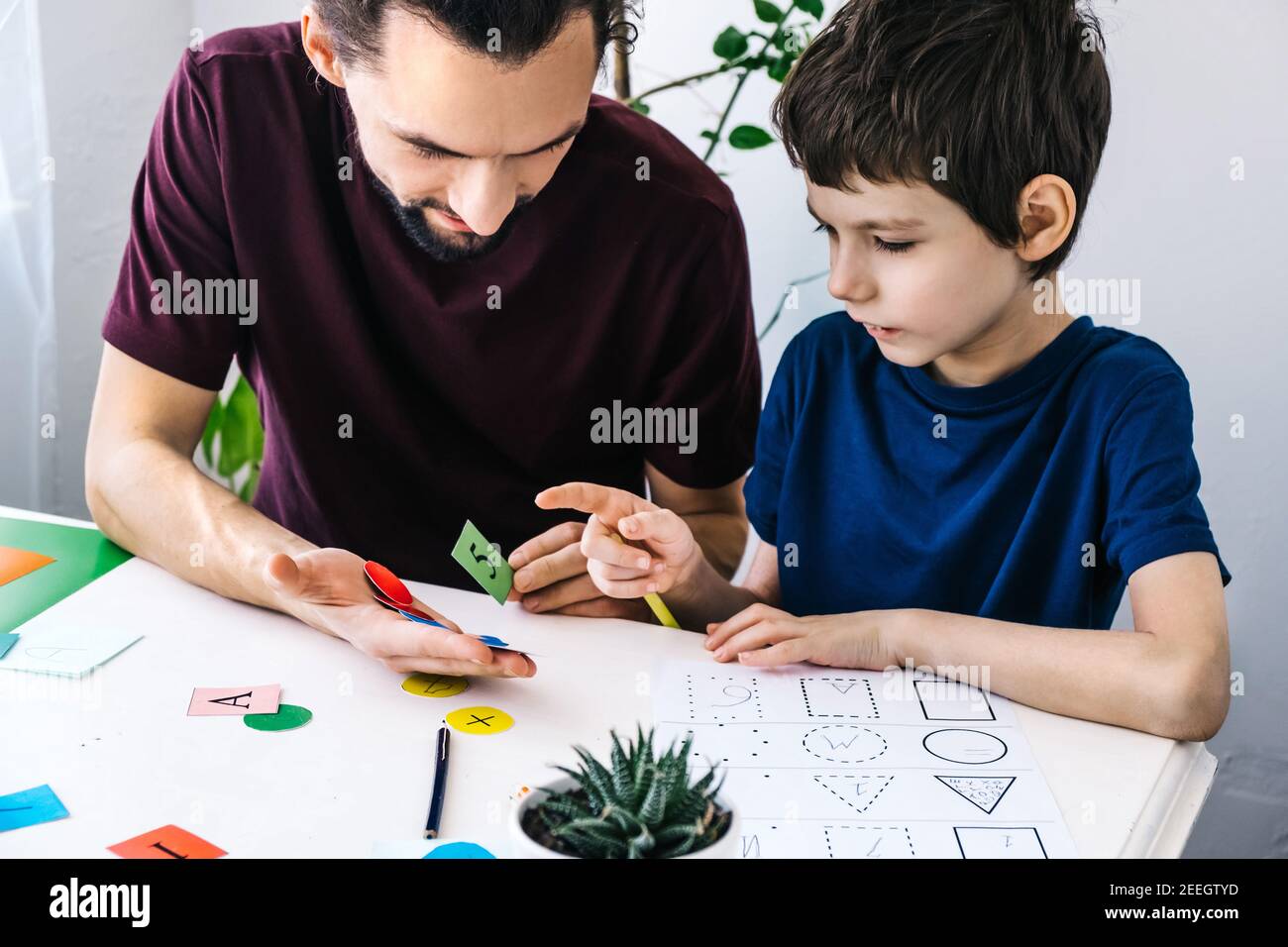 Autism awareness concept. Autism schoolboy during therapy at home with ...