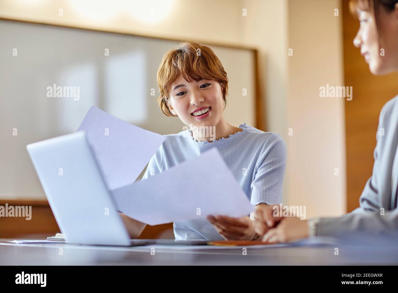 Young Japanese women working Stock Photo - Alamy