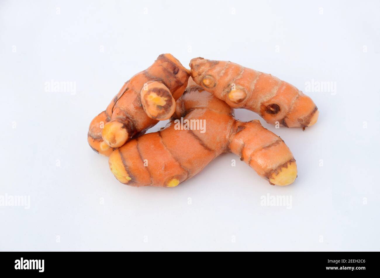 Ripe orange color turmeric isolated on white background Stock Photo - Alamy
