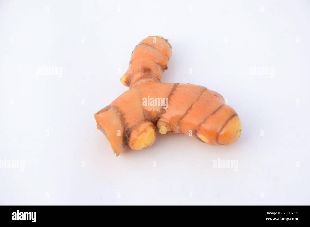 Ripe orange color turmeric isolated on white background Stock Photo - Alamy