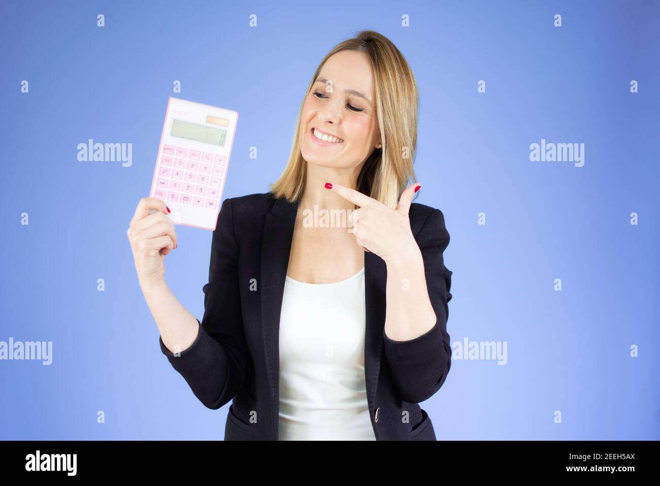 Young business woman hold digital calculator over purple background ...