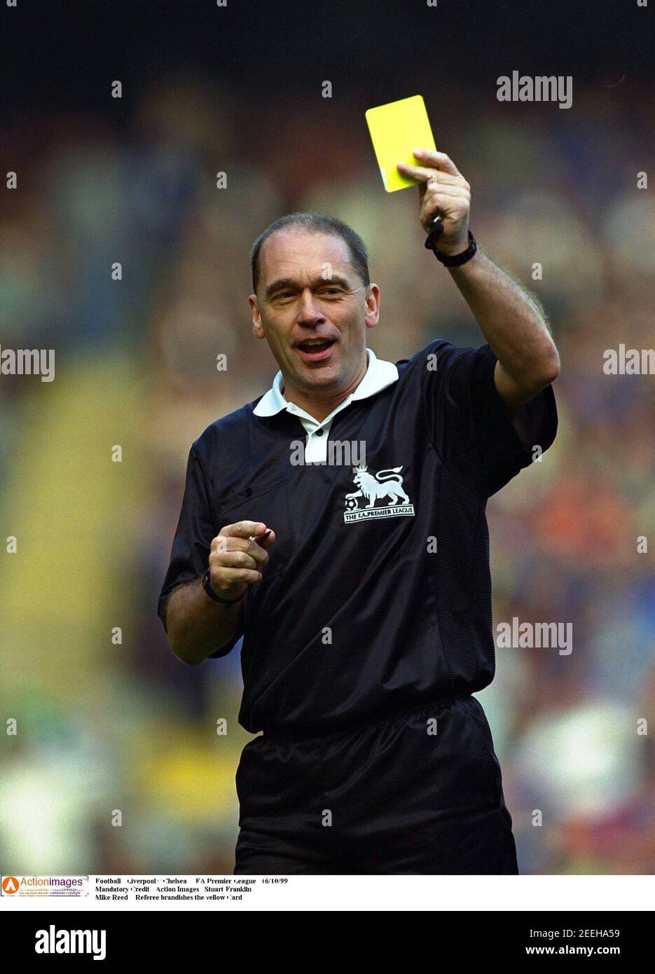The Referee Brandishes The Yellow Card High Resolution Stock ...