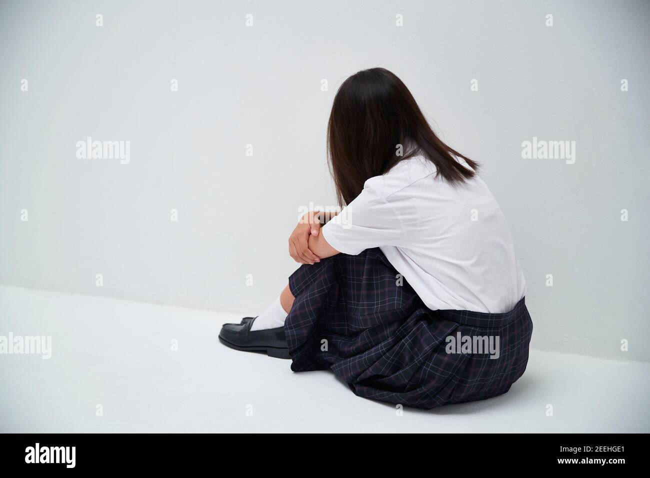 Depressed Japanese junior high schoolgirl Stock Photo - Alamy