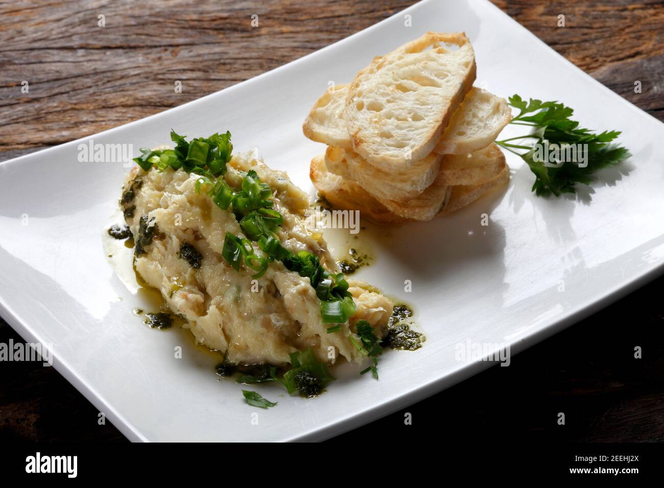 Salt cod with green sauce hi-res stock photography and images - Alamy