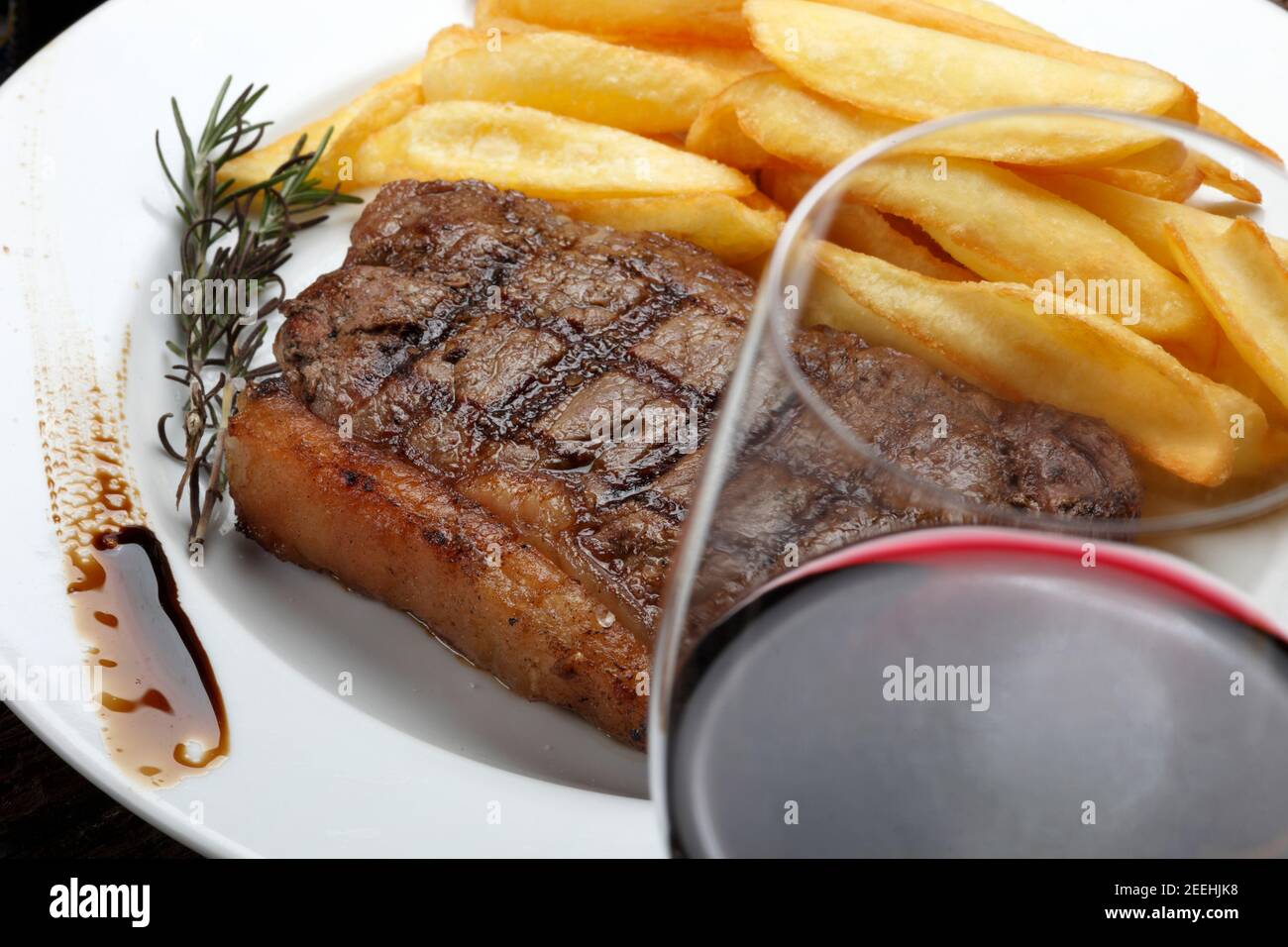 Steak with fries and red wine Stock Photo - Alamy