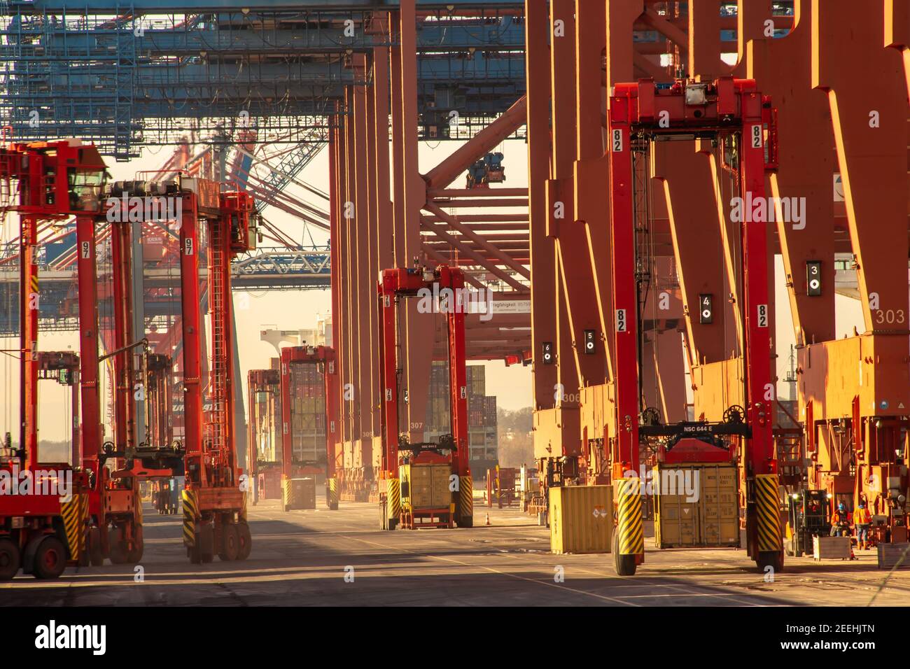 Cranes in the container harbour port during logistic loading process at ... Cranes in the container harbour port during logistic loading process at ...