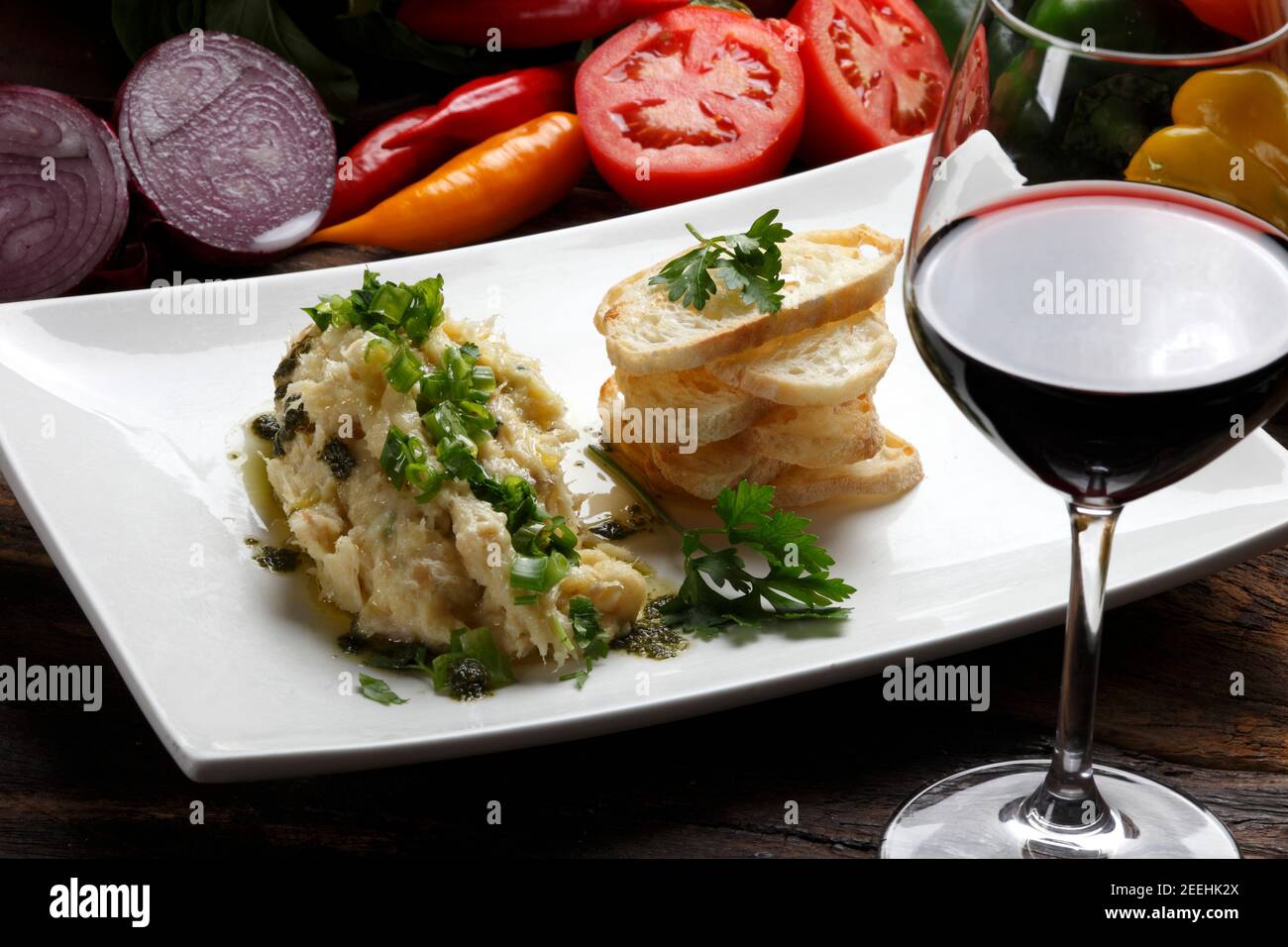 Cod shredded with ciabatta and red wine Stock Photo - Alamy