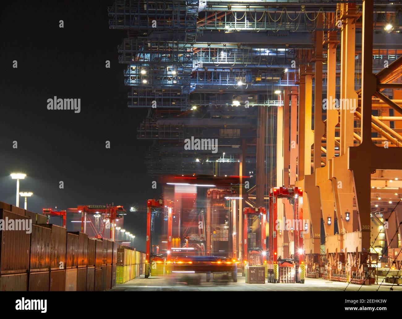 Cranes in the container harbour port during logistic loading process at ... Cranes in the container harbour port during logistic loading process at ...