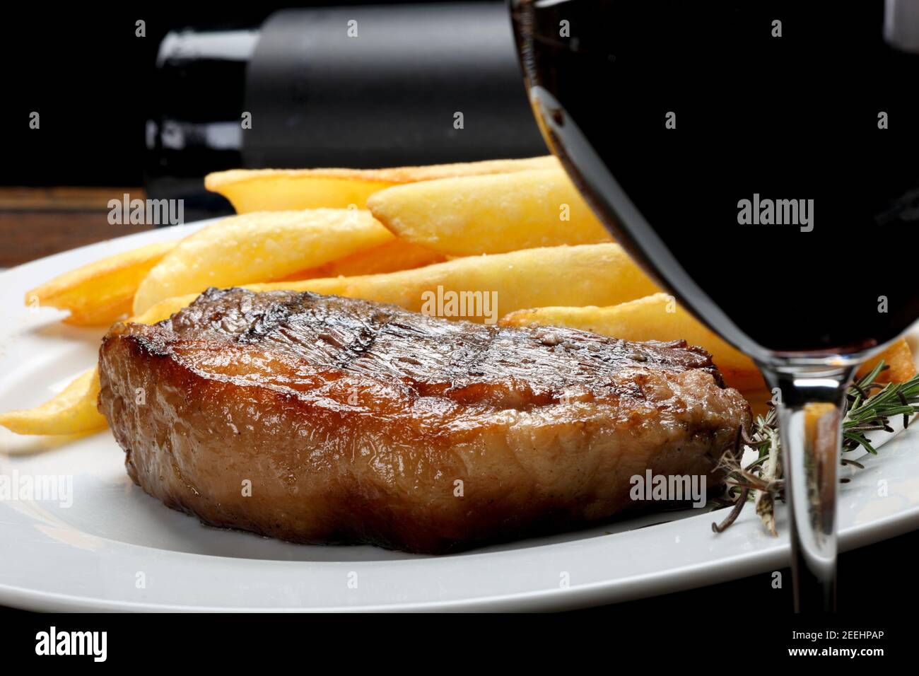 Steak with fries and red wine Stock Photo - Alamy