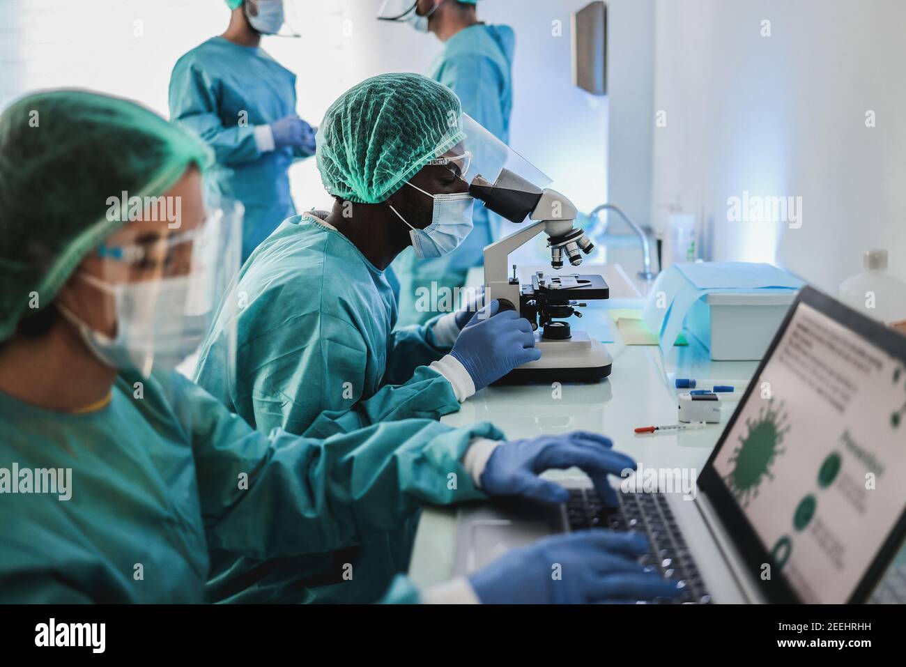 Scientists team in hazmat hi-res stock photography and images - Alamy