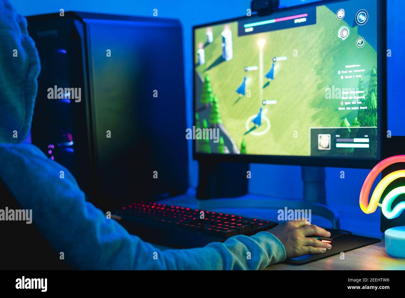 Streamer gamer playing at strategy game online - Focus on right hand ...