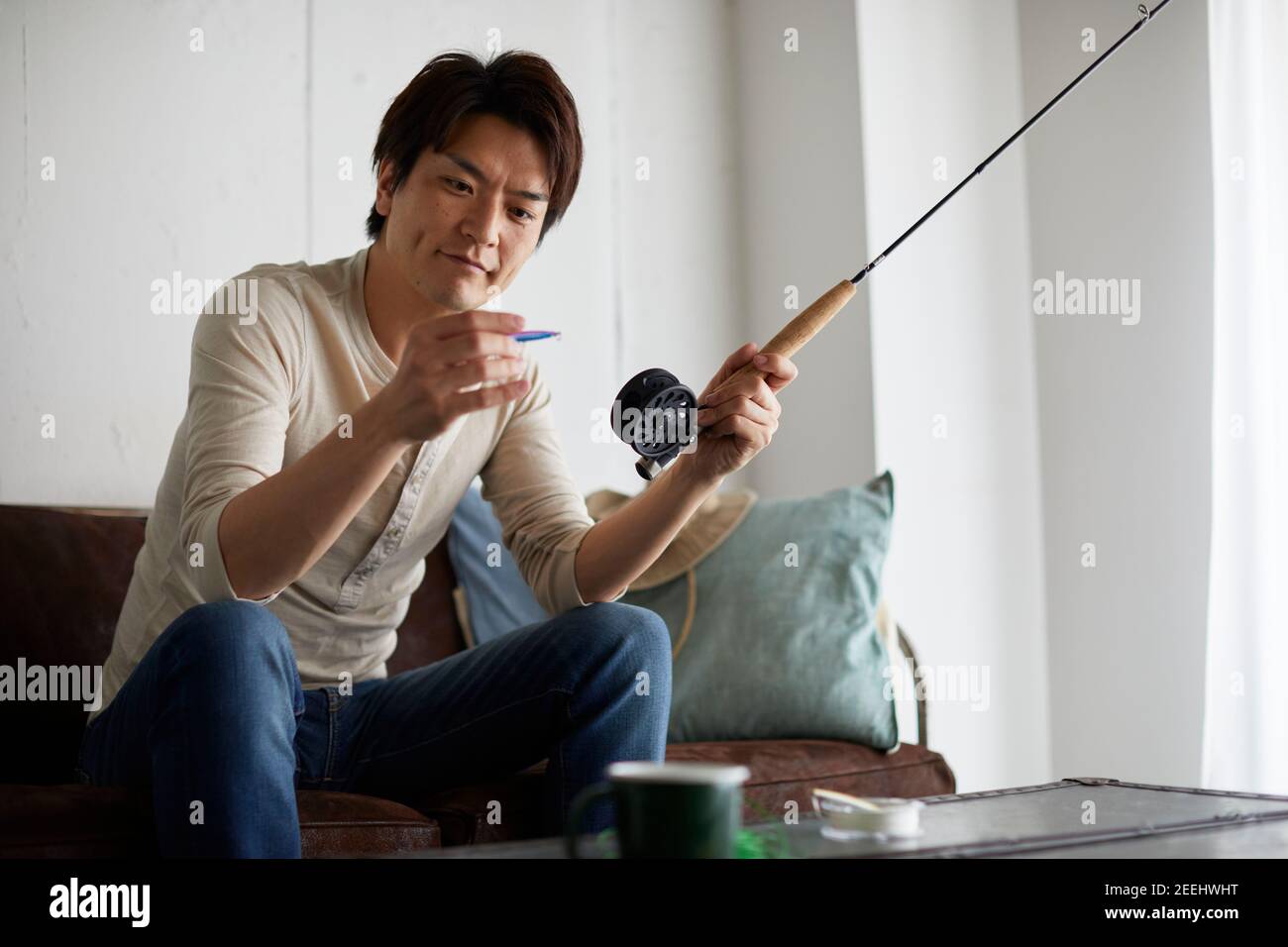 Young japanese man fishing hi-res stock photography and images - Alamy