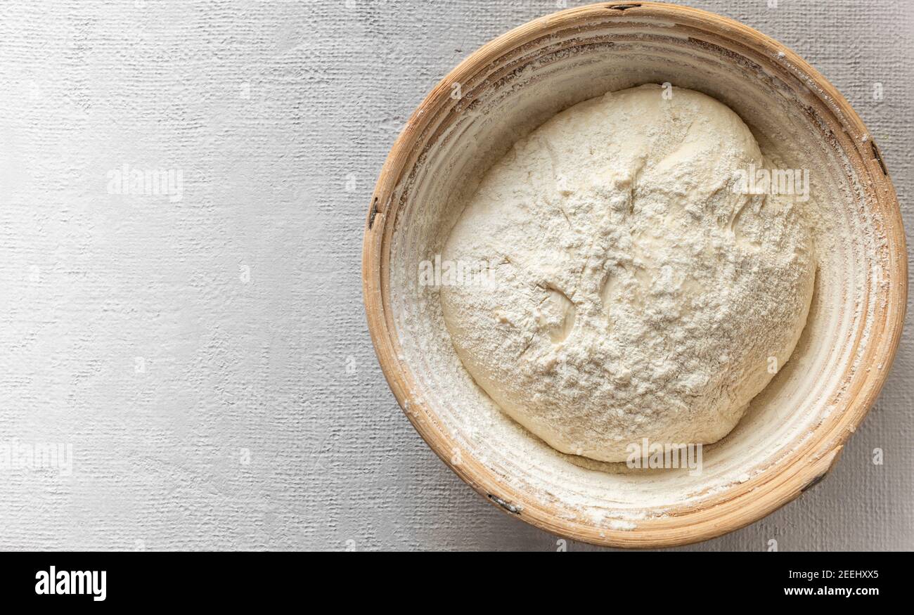 The process of raising the dough in a special basket. Dough made from ...