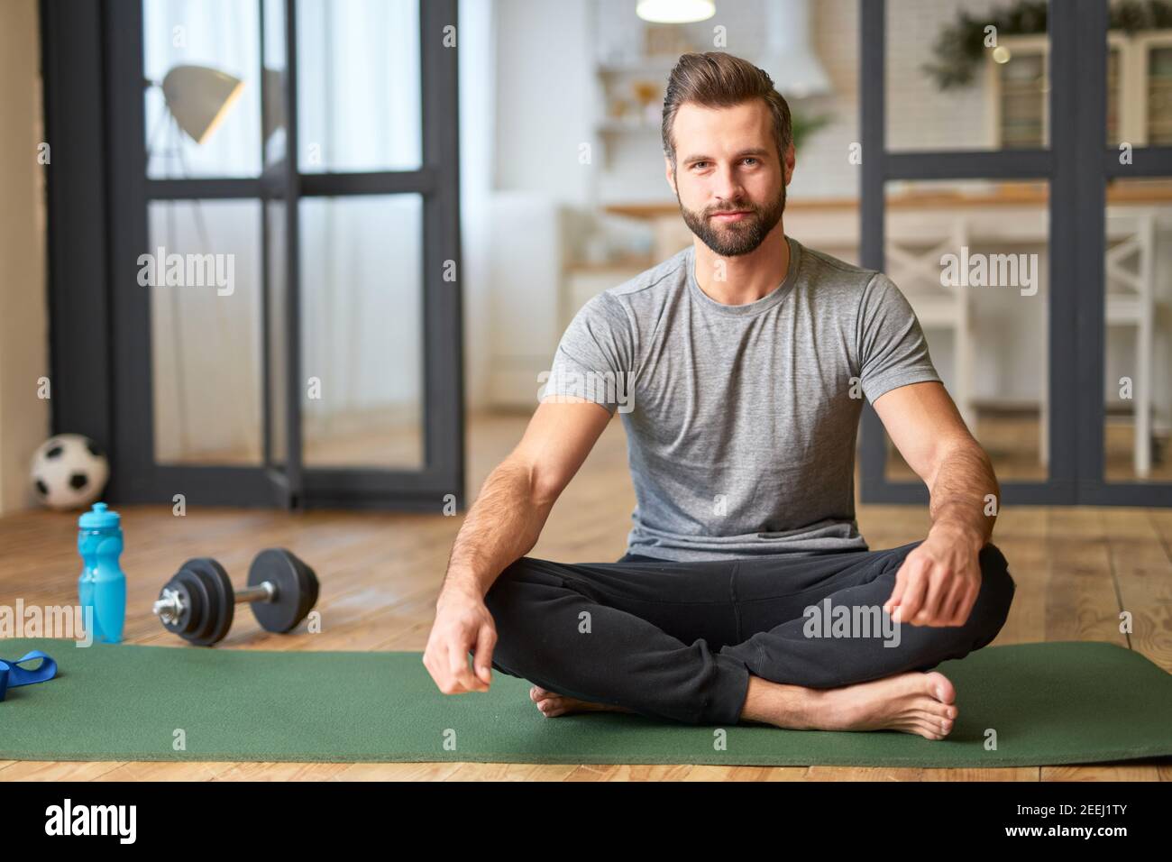 Muscular man sitting on floor hi-res stock photography and images - Alamy