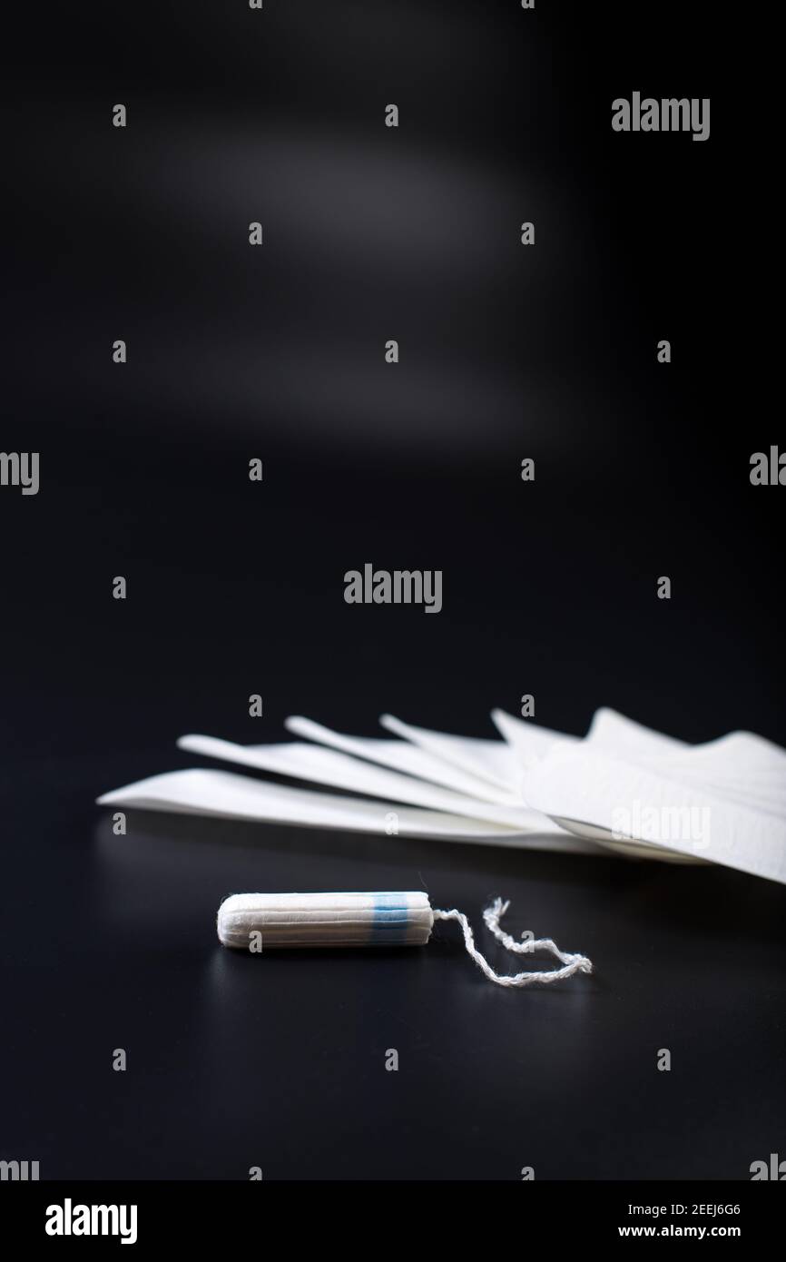 Tampon and flat pads on black background with copy space Stock Photo ...