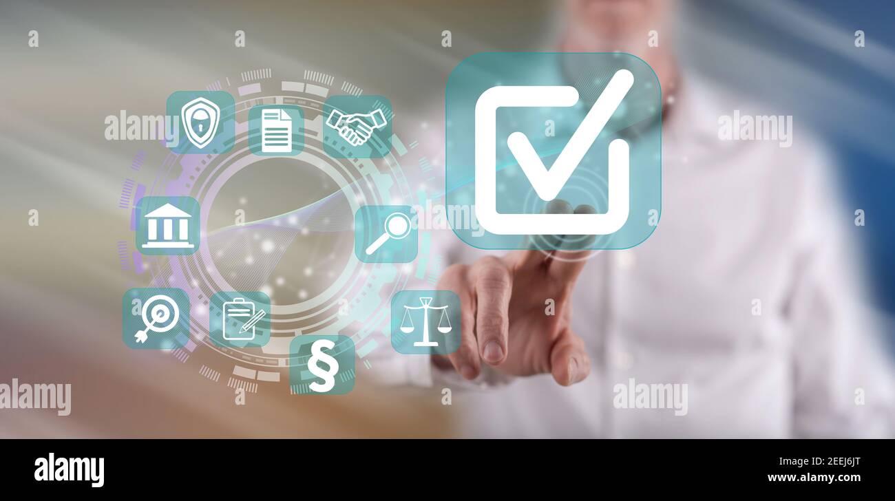 Man touching a validation concept on a touch screen with his finger ...