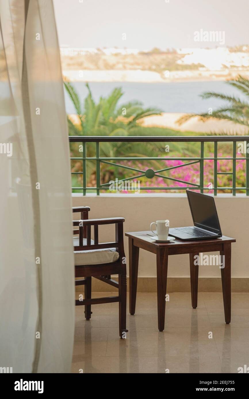 Working computer hotel balcony hi-res stock photography and images - Alamy