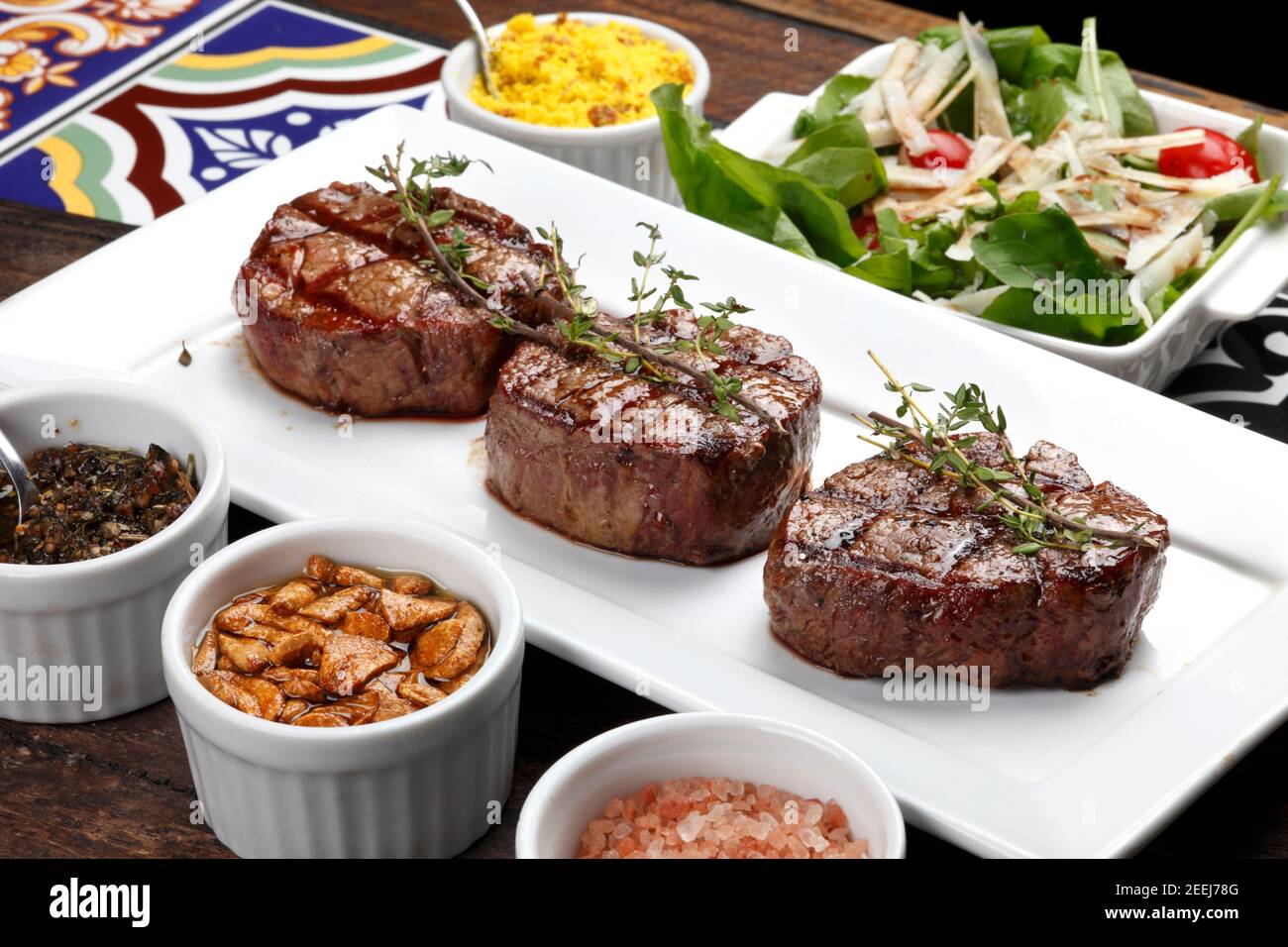 Three steaks roasted on the grill Stock Photo - Alamy