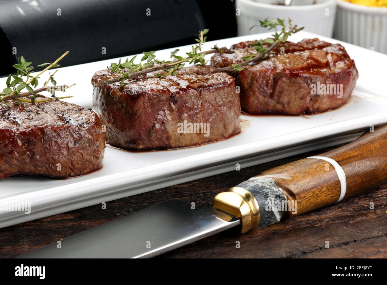 Three steaks roasted on the grill Stock Photo - Alamy