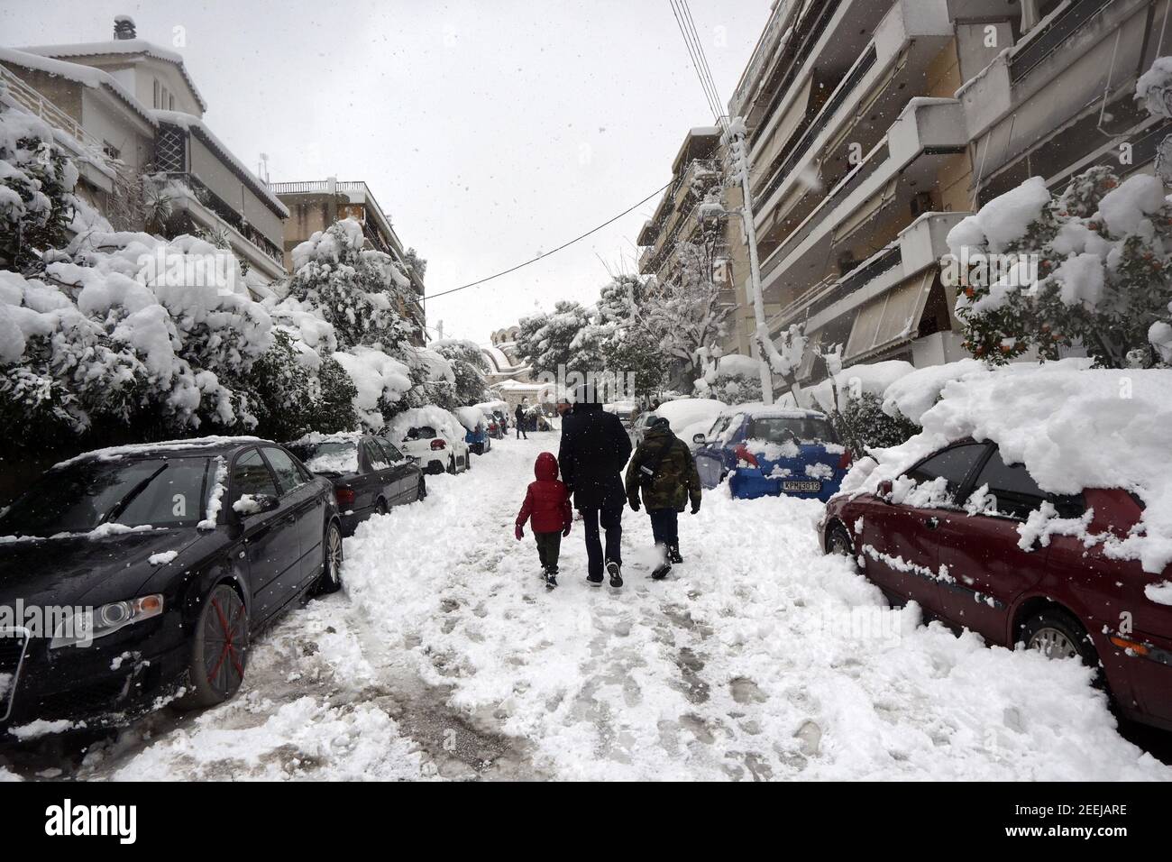 Athens, Greece. 16th Feb., 2021. People walk in a street covered in ...