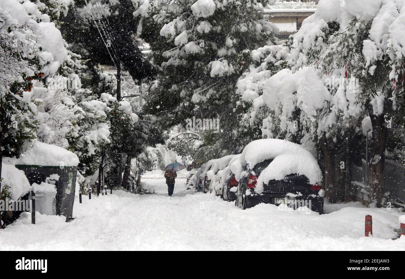 Athens, Greece. 16th Feb., 2021. People walk in a street covered in ...