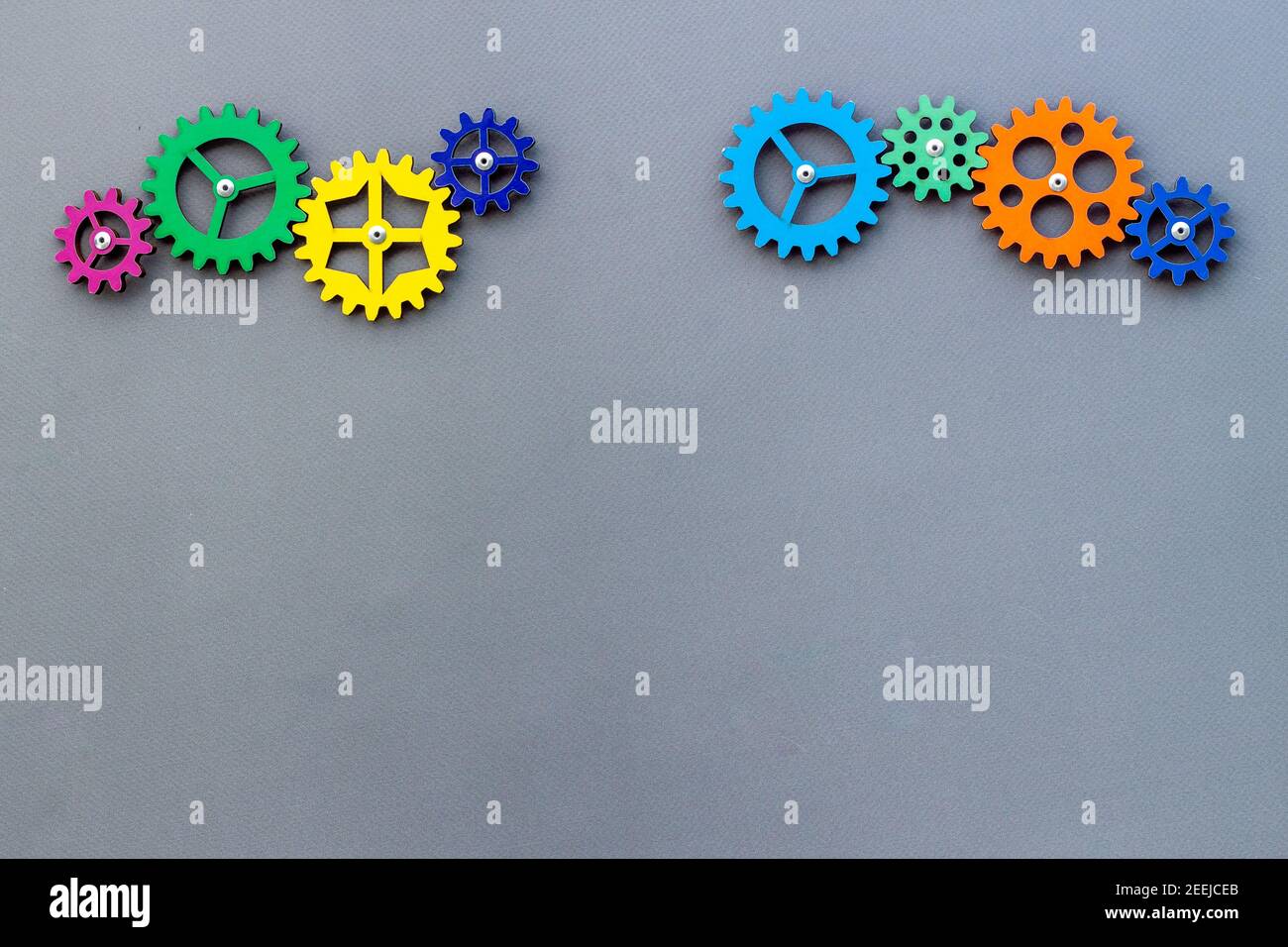 Teamwork concept. Gears connect in working mechanism, overhead view ...